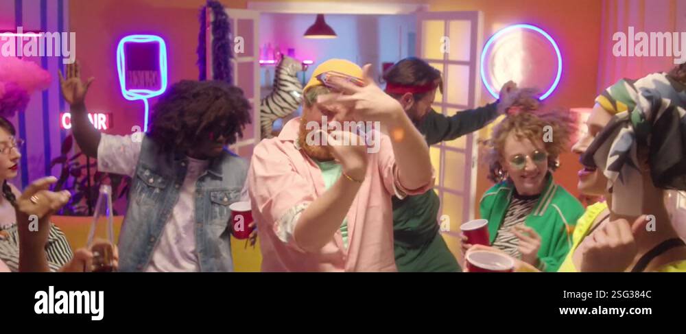 Man Dancing with Friends at Y2K Party Stock Video Footage - Alamy