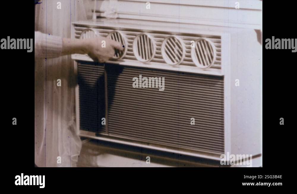 1960s: Toast in toaster. Woman loads dishwasher. Hands with washing ...