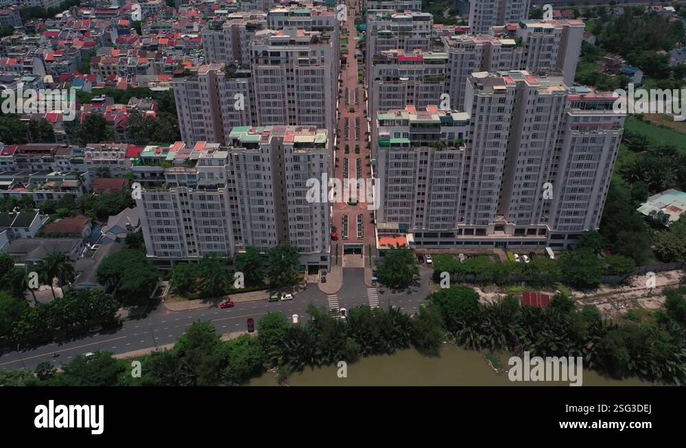 Dramatic drone Fly in over central road between tall buildings of a ...