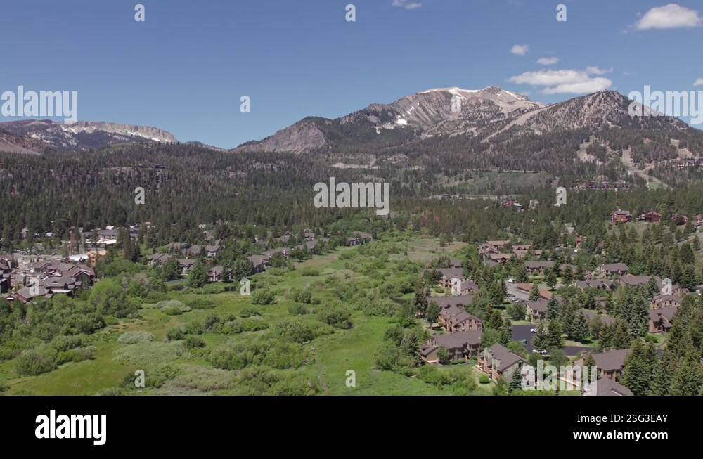 4k drone footage camera tilt down of beautiful Mammoth Mountain in the ...