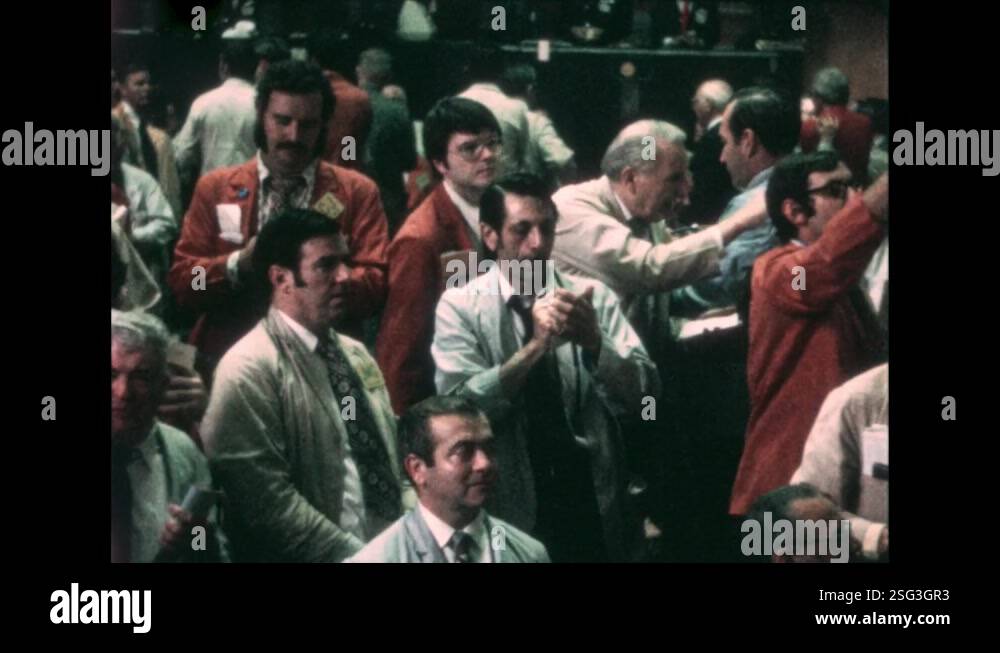 1970s: Stock-brokers on the grain exchange. They gesture and shout in ...