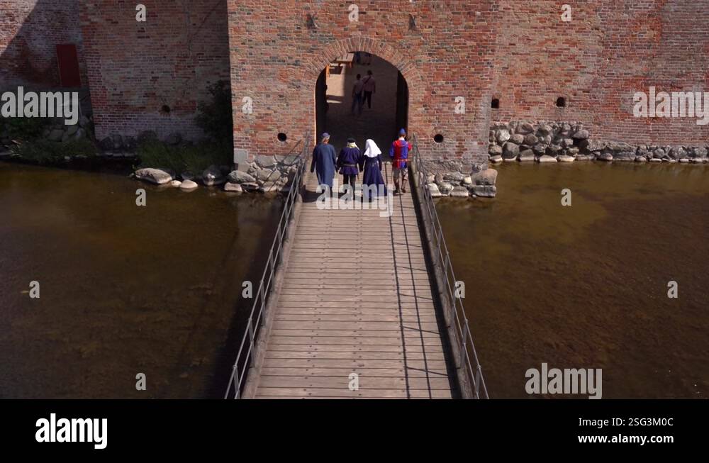Cosplay Actors Walking On The Entrance Of Medieval Castle Of Spottrup ...