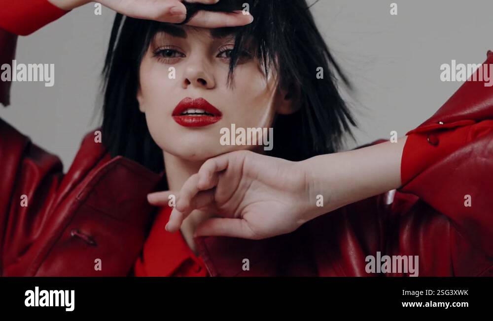 Close-up fashion shoot with a look into the camera of a woman in ...