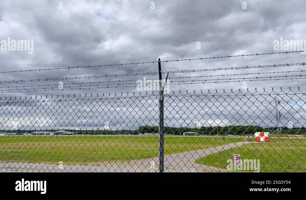 Augusta Regional Airport chain link fence line barbed wire long slow ...
