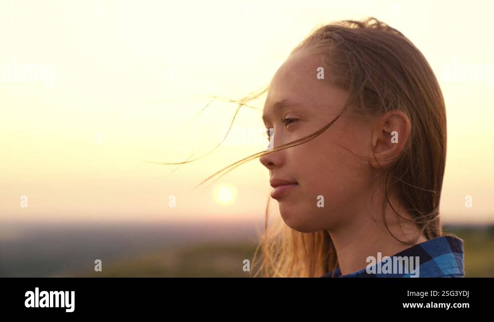 girl with long hair wind. smile child girl sunset. person breathes ...