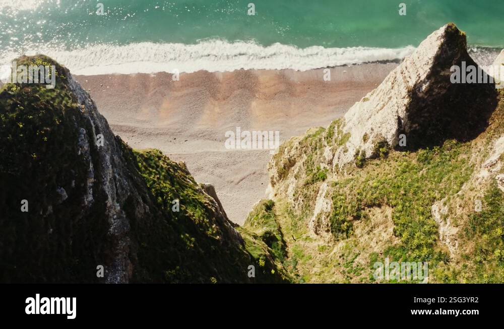 View from above from the top of a cliff with sharp peaks to the ...