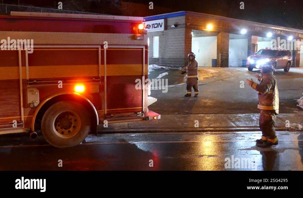 Fire engine turning in a driveway at night during call out, two fire ...