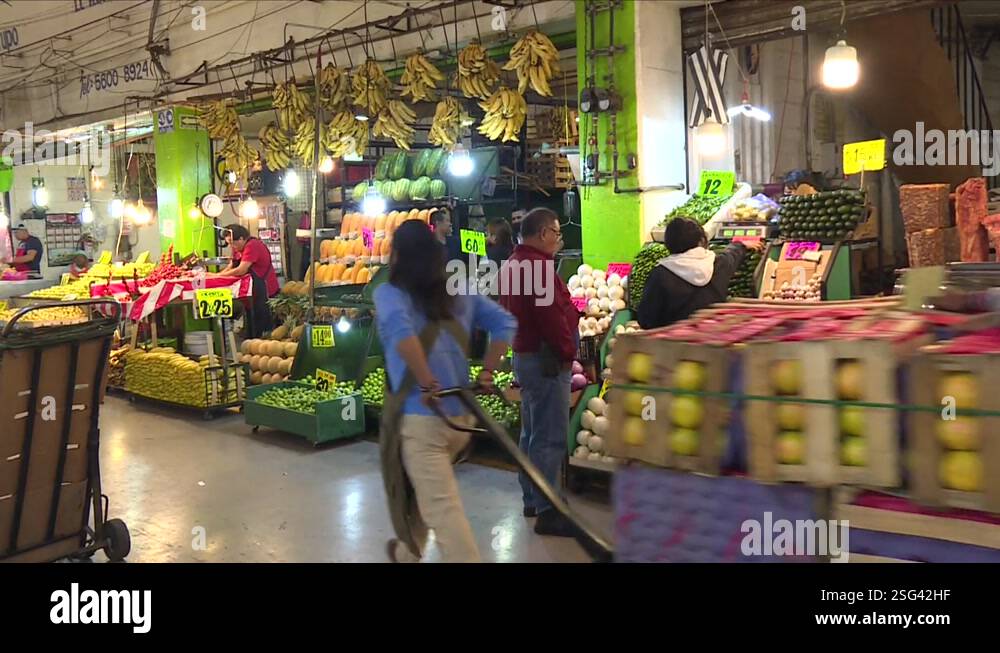 Worker moving a mango cart Stock Video Footage - Alamy