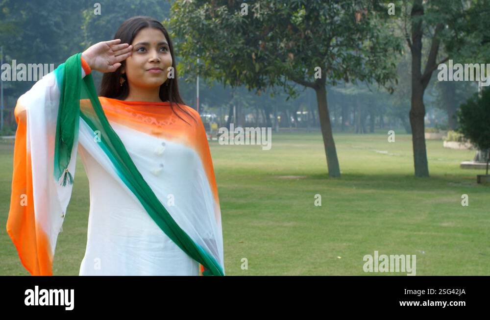 A beautiful teenage girl saluting the Indian flag on the occasion of ...