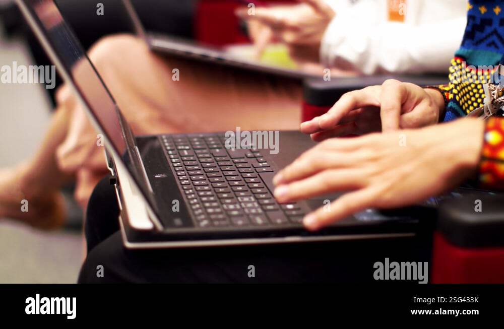 Students in lecture typing on laptop keyboard, public conference Stock ...