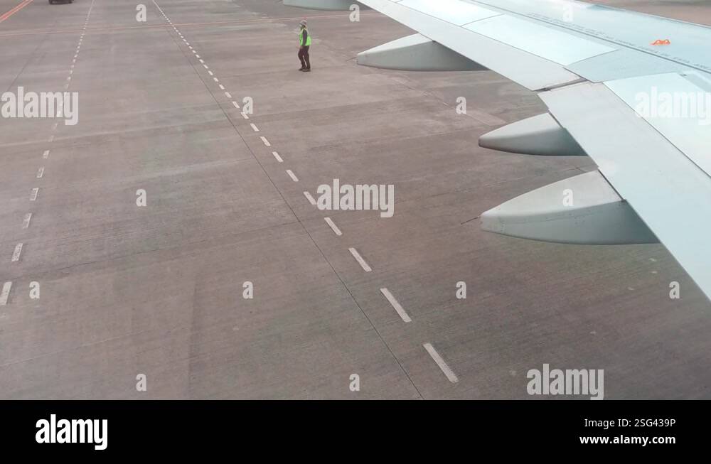 Shot taken from plane window of the turmac before departure at daytime ...