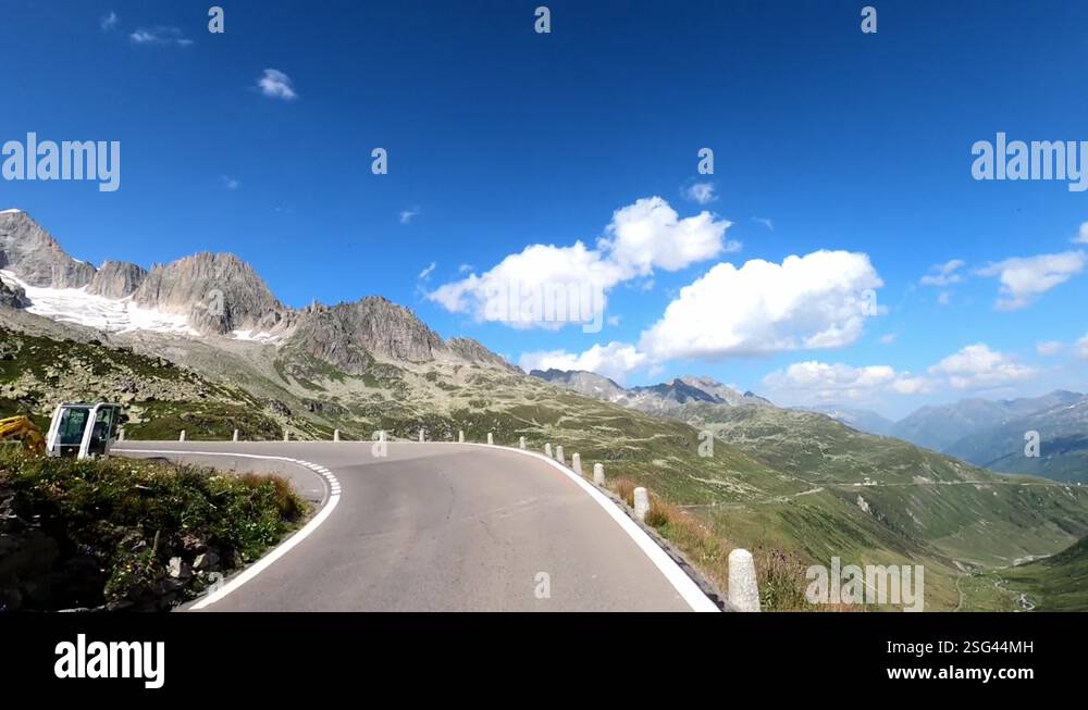Driving a car over a pass road in Switzerland. Dashcam View. It's nice ...