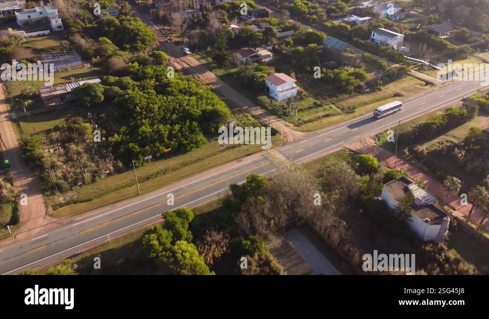 White bus driving on Punta del Este main road in Uruguay. Aerial ...