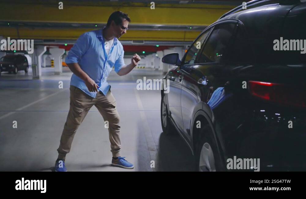 male driver in the parking lot static electricity shock from the car ...