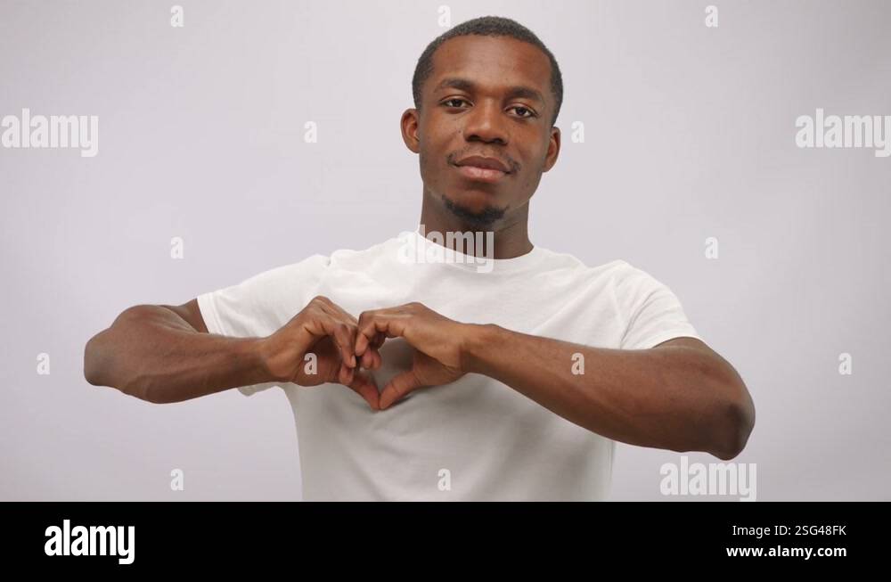 Black actor shows hand heart describing true feelings with smile in ...