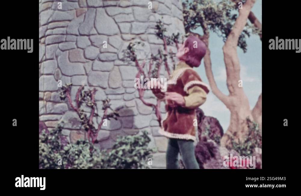 1950s: Prince climbs Rapunzel's hair. Rapunzel holds hand to her mouth ...