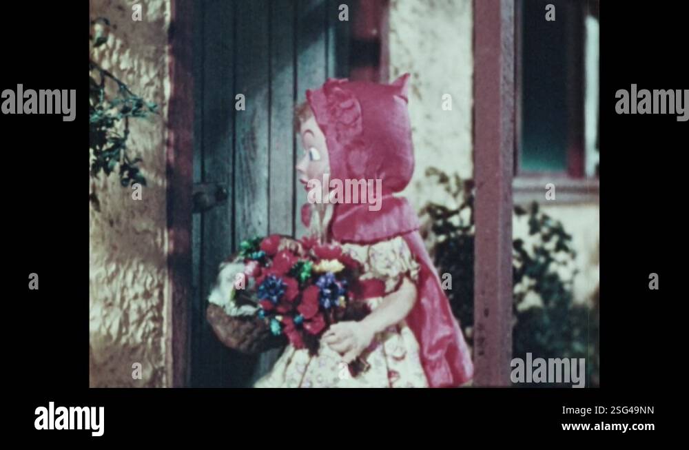 1940s: Stop-motion puppet animation- Little girl in red cape walks up ...