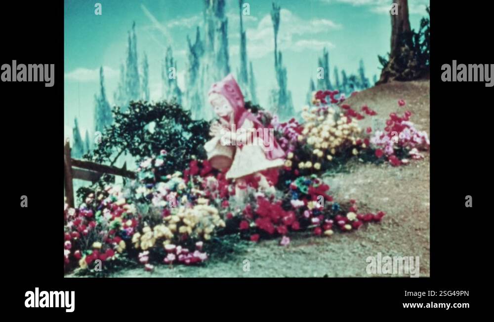 1940s: Stop-motion puppet animation- Little girl in red cape sits by a ...