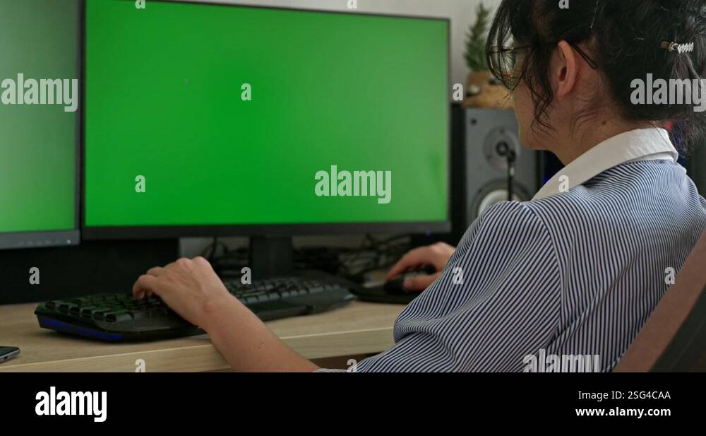 Young Woman Wear Glasses Look Watch at Green Screen Monitor Desktop PC ...