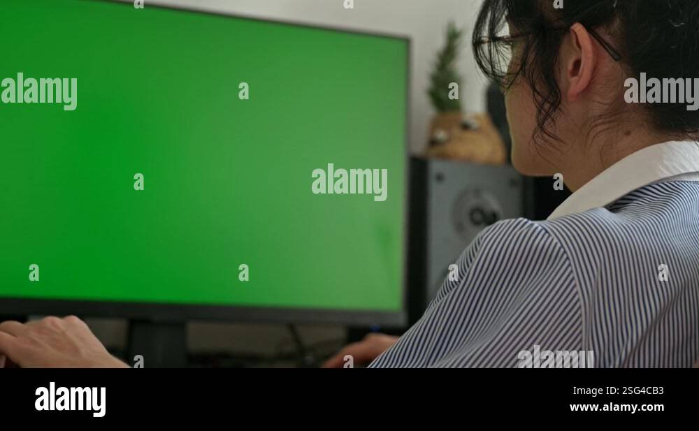 Young Woman Wear Glasses Look Watch at Green Screen Monitor Desktop PC ...