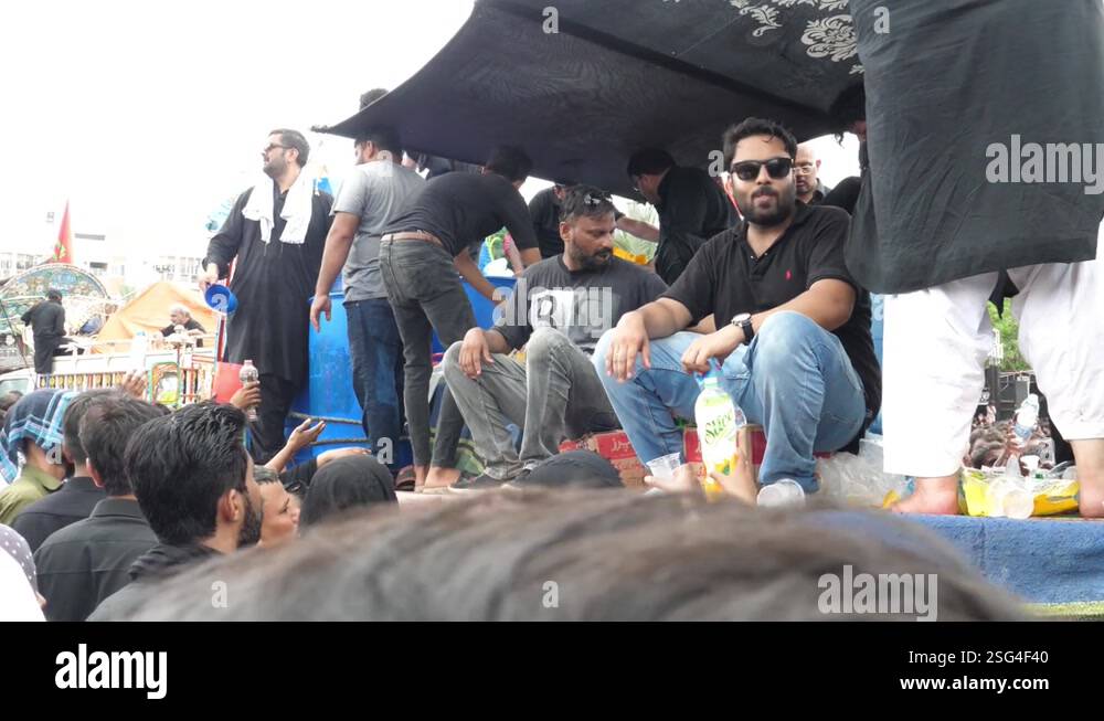 Group Of Pakistani Men Drinking Water At Parade Of Muharram In Karachi Stock Video Footage - Alamy