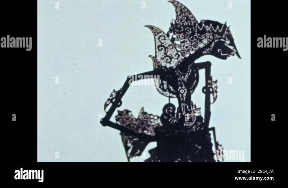 Indonesia 1950s: Wayang shadow puppets move across the screen. Javanese dancer Stock Video ...
