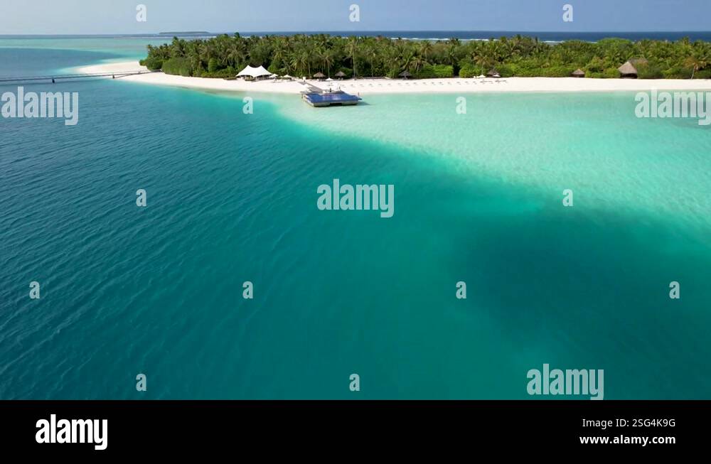 Aerial view of Maldives island with overwater infinity pool and palm ...