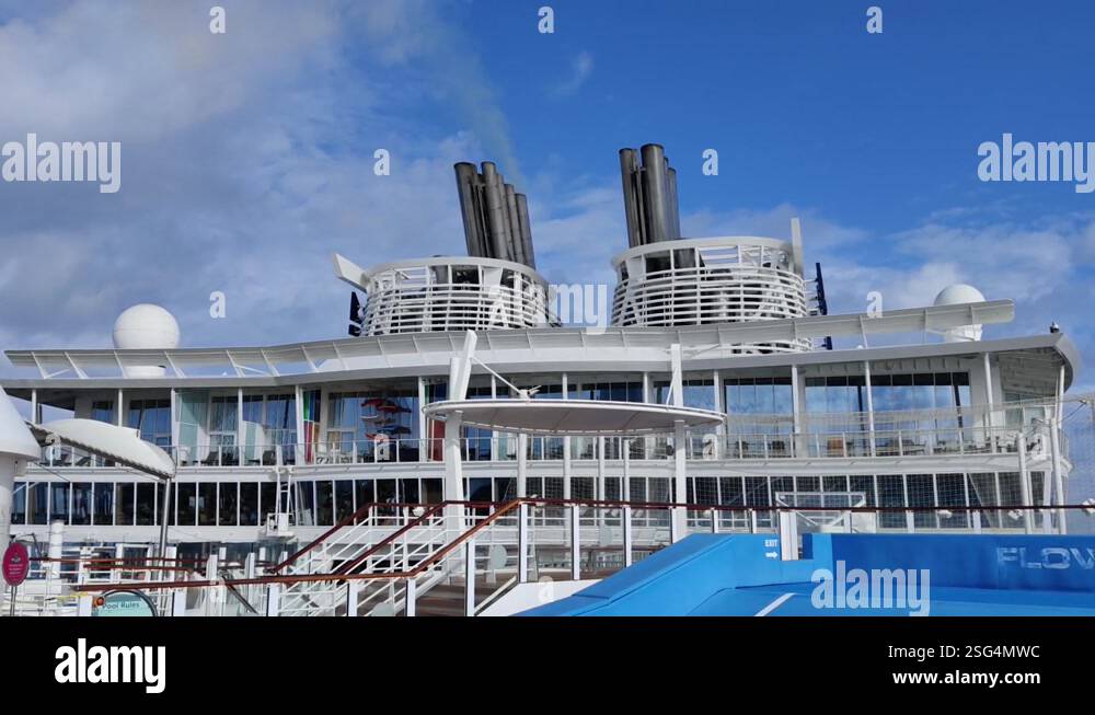 Huge Cruise ship Chimney or smoke funnel with a smoke billowing out in ...