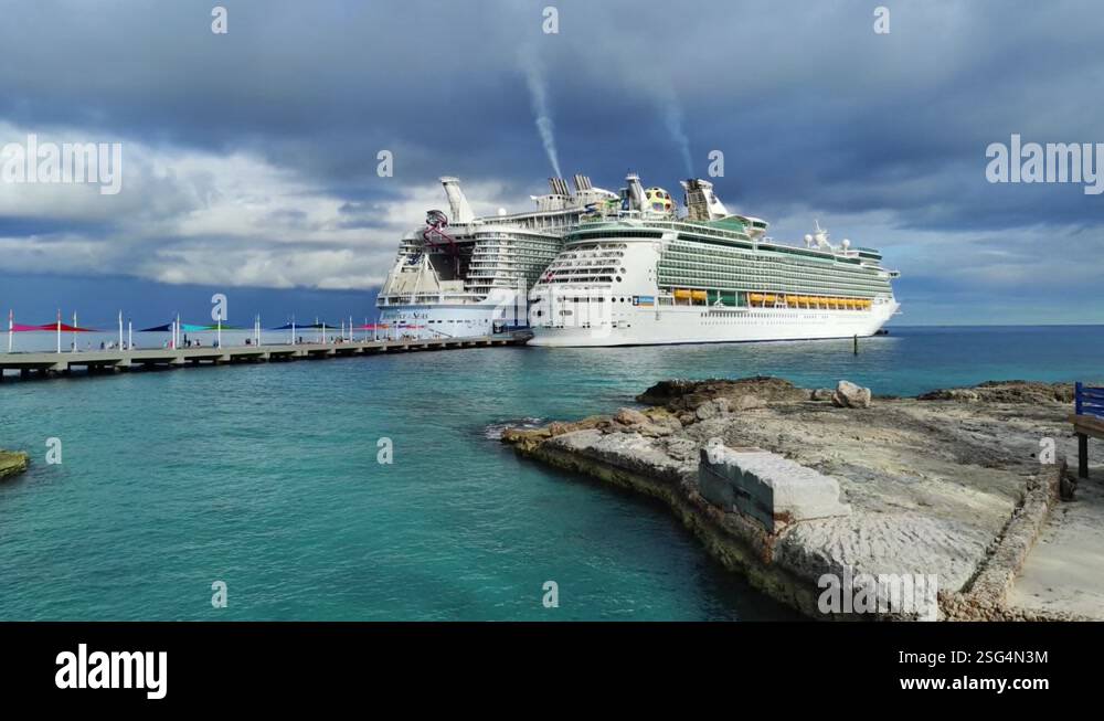 Two Luxury cruise ships docked together in the port of Bahamas ...