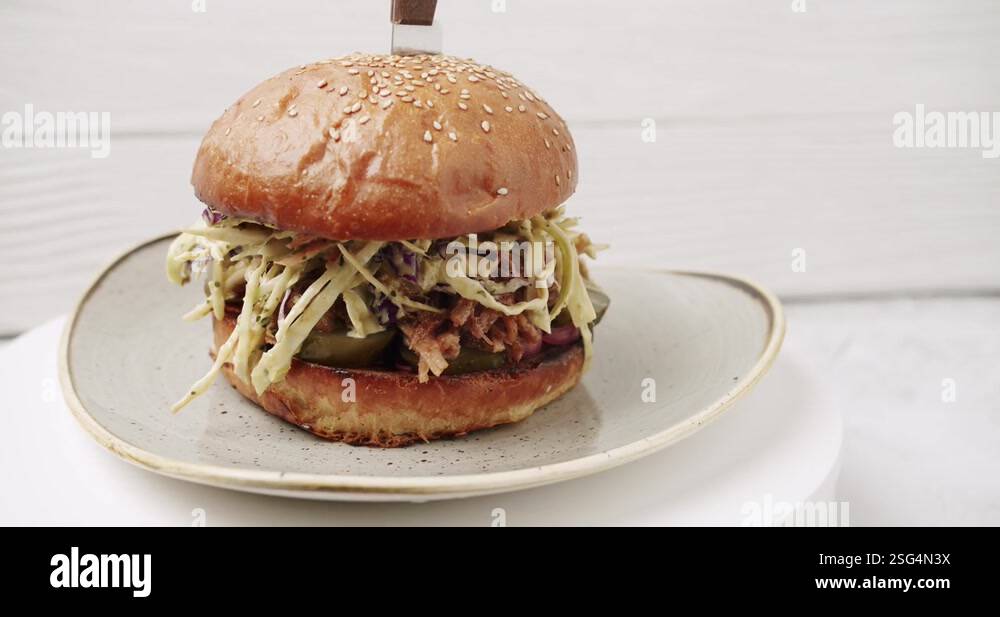 Cool beautiful fresh juicy cooked burger rotate on turntable on white ...