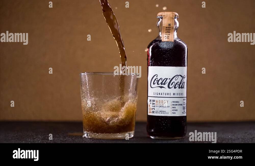 Krivoy Rog, Ukraine - 31.08.2022 super slow motion, cola and ice cubes ...