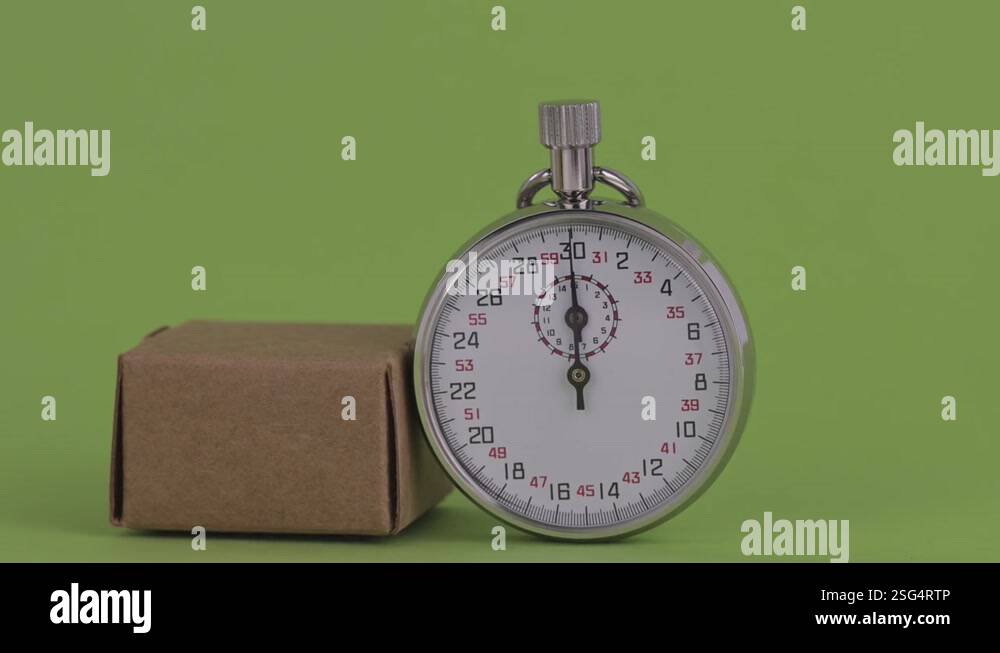 Mechanical stopwatch time on a green screen Stock Video Footage - Alamy