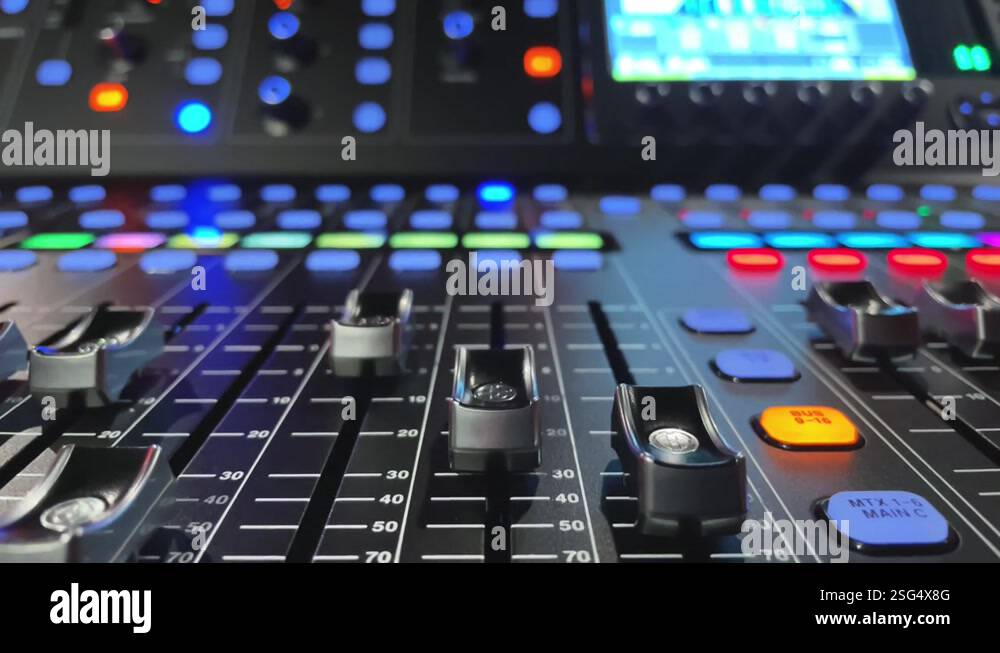 Detail of mixing desk or concole and moving volume faders in slow ...