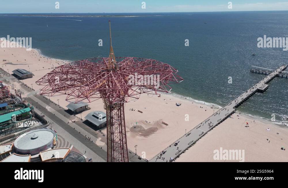 flying counter clockwise around iconic parachute jump tower of Coney Island Stock Video Footage ...