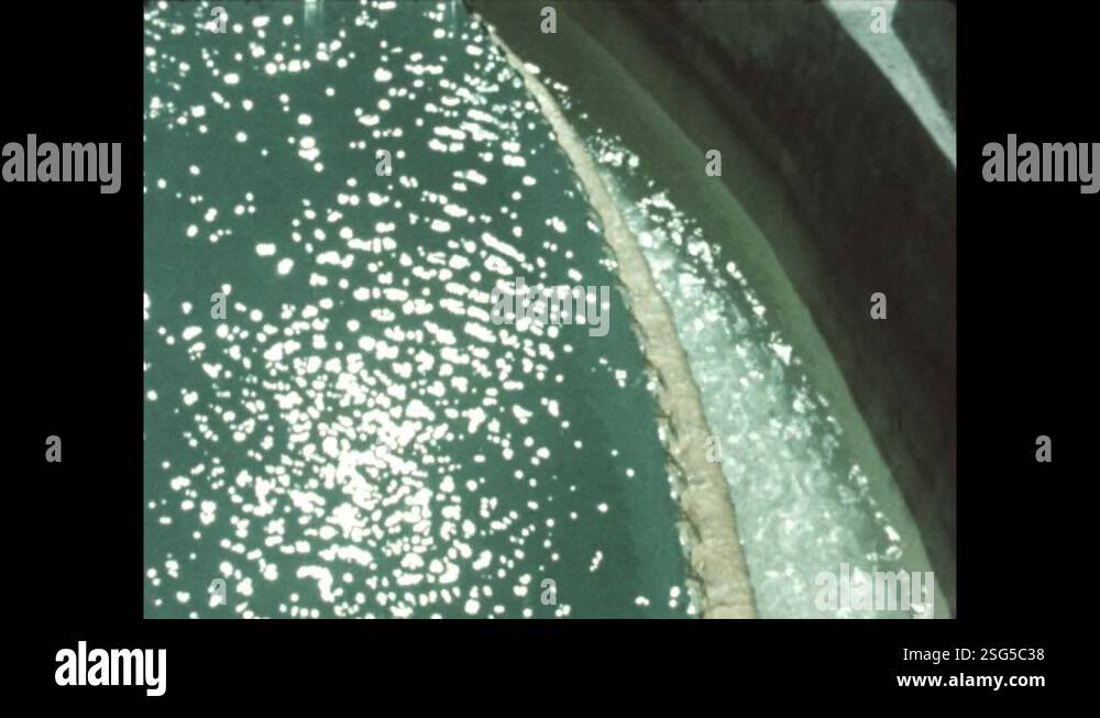 1950s: White powder falling from chute. Water in tank. Water in tube ...