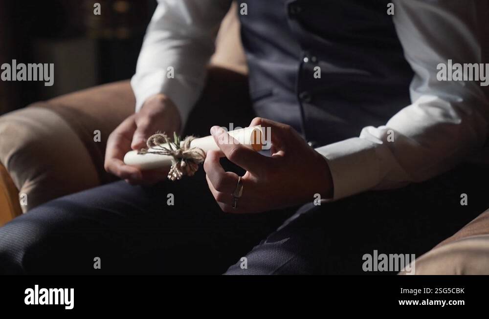 The Man Opens The Scroll. The Hand of Men Unfolds the Old Antique ...