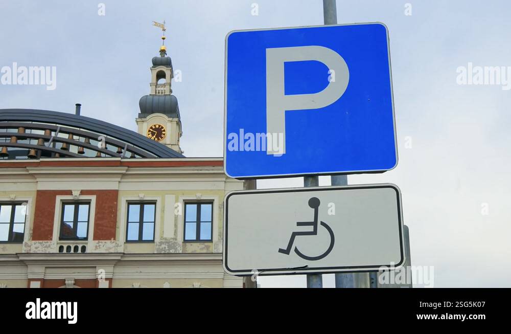 Establishing shot: Old disabled sign on a pole at an old town in Europe ...