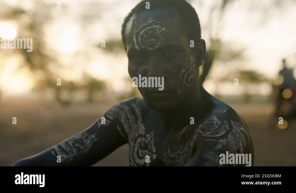 A Portrait Of A Karo Tribe Man With Traditional Body Painting In Omo ...