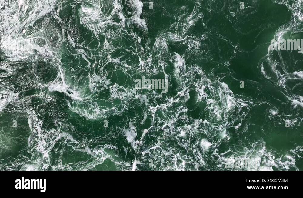 Patterns created by tide surging through storm surge barrier; aerial ...