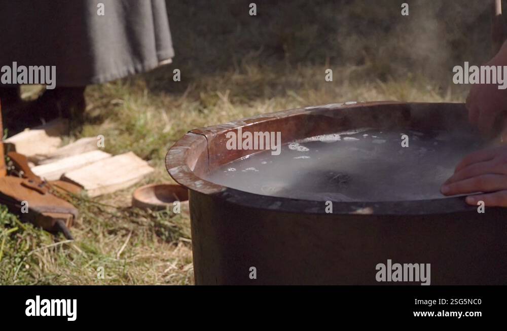 Medieval Method Of Dyeing Cloth. Fabric Soaked In Cauldron With Hot ...