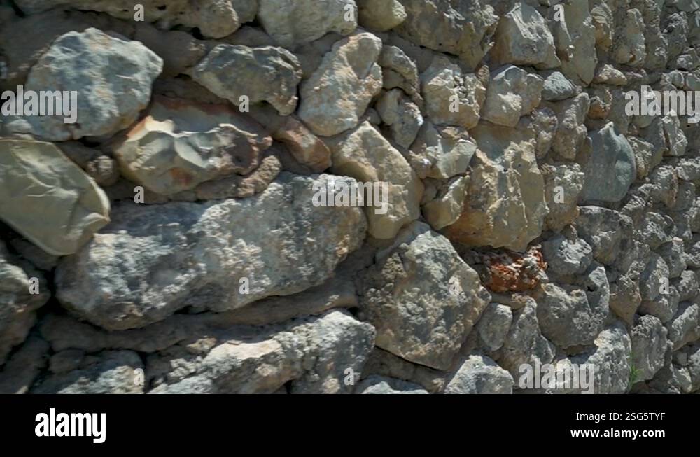 Right dolly slide, frontage built with large raw unworked stones ...