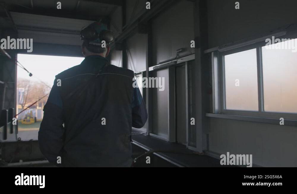 Supervisor overseeing the loading process and securing cargo in large ...