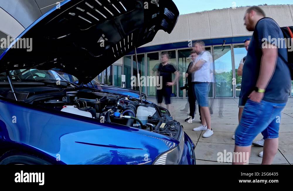 Visitors Taking A Look On Open Hood Of A 50x M5 E39 Car At The BMW ...