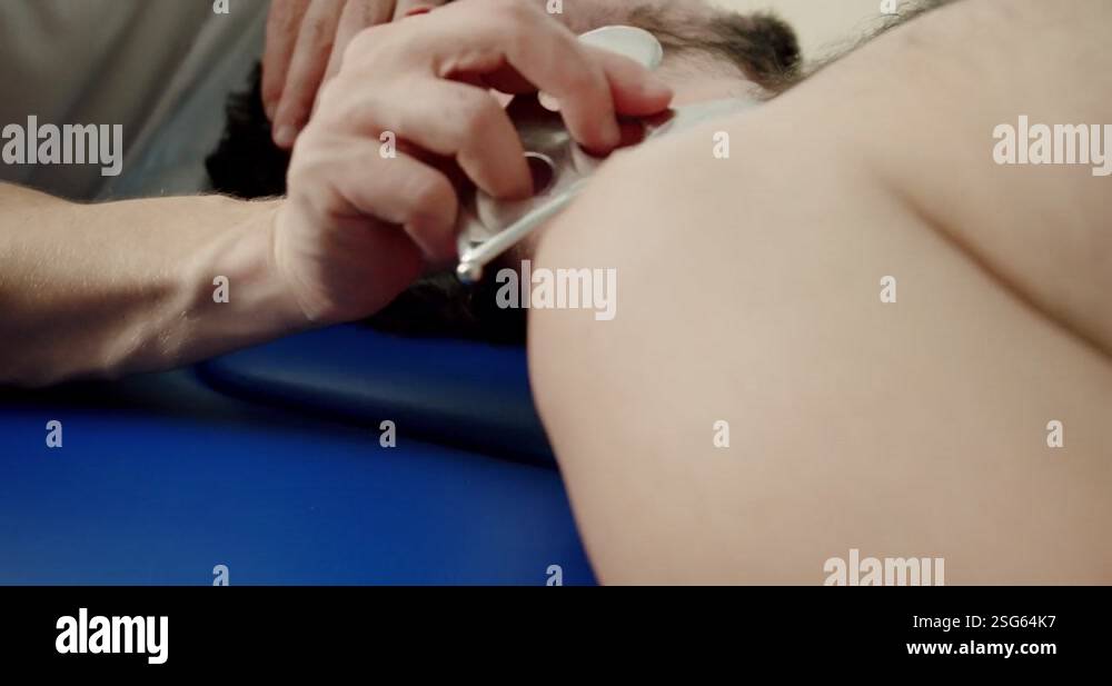 Fascia release soft tissue treatment on her neck with stainless steel ...