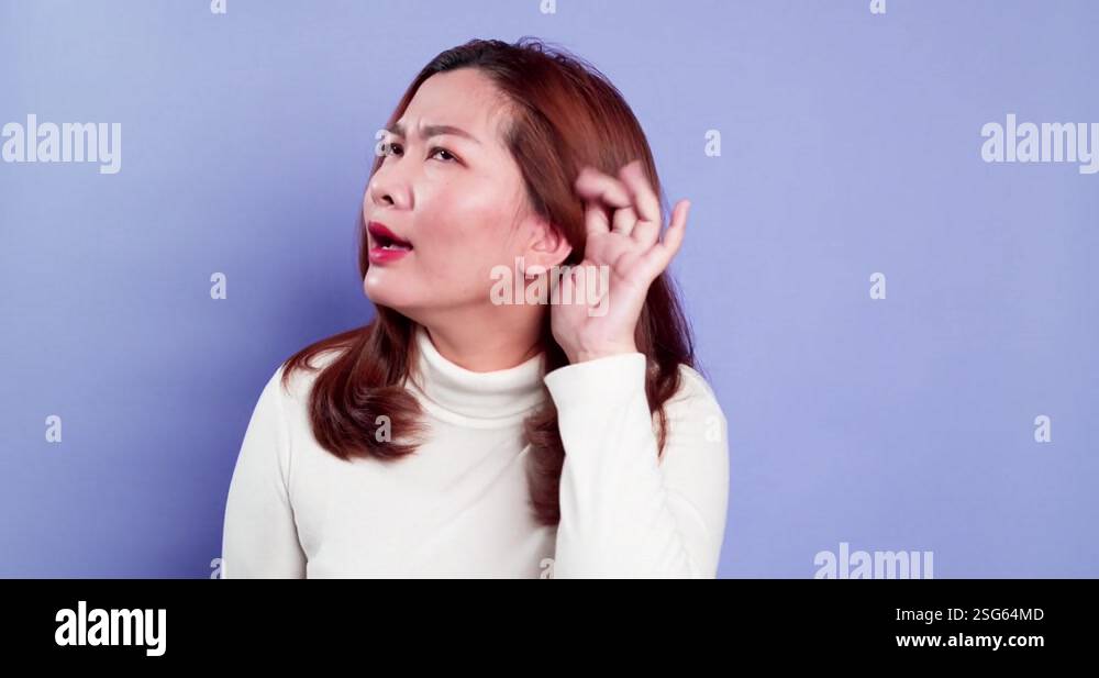I can't hear you! What? Confused woman having hearing problems asking ...