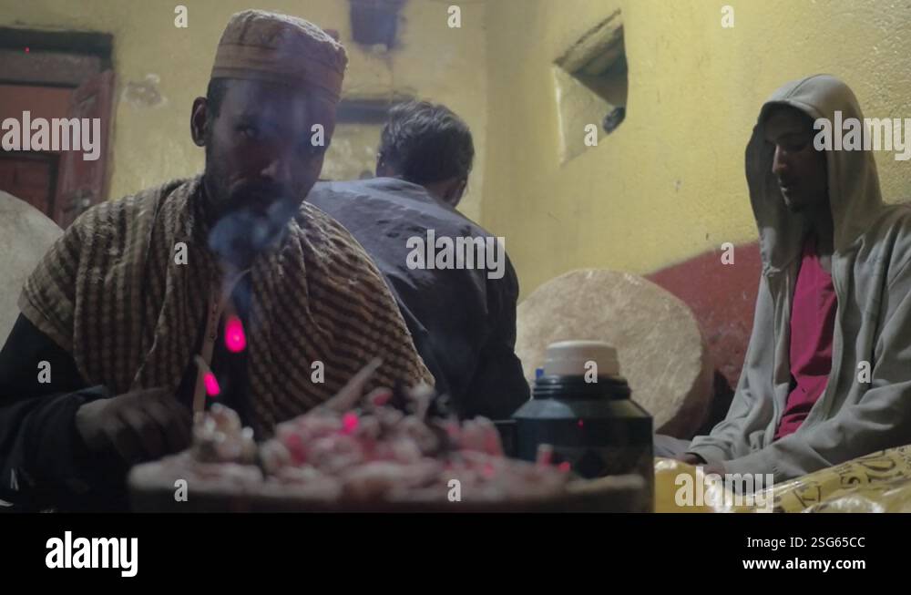 Ethiopian men chewing khat during a sufi ceremony, Harar, Ethiopia ...