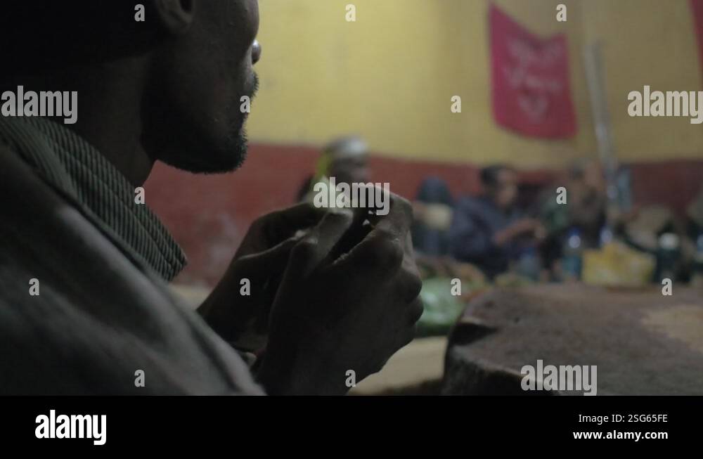 Ethiopian men chewing khat during a sufi ceremony, Harar, Ethiopia ...