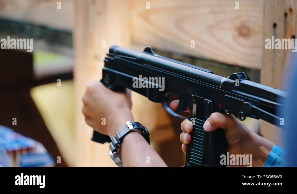 Child holding polish PM Rak submachine gun. Target practice. Firearm ...