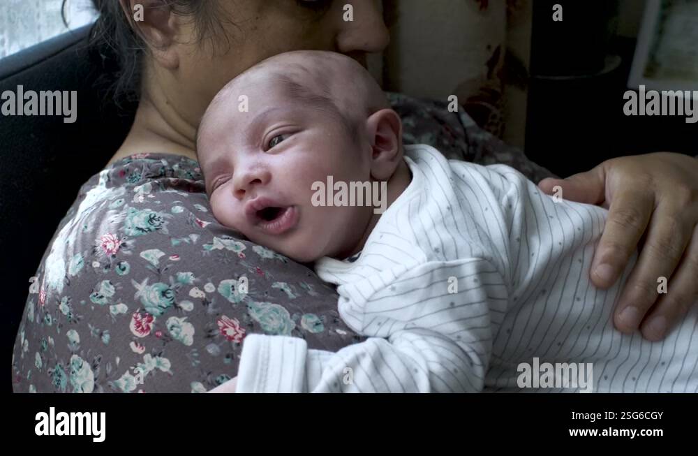 Adorable New Born Baby Boy Resting On Mothers Shoulder Half Asleep And ...