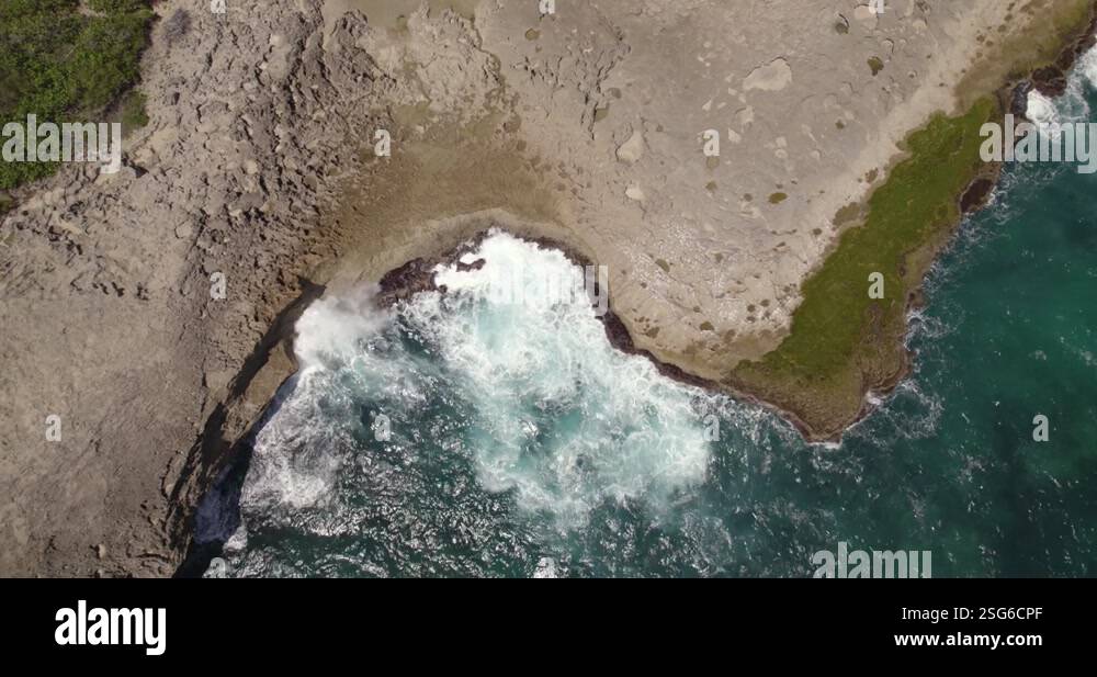 Aerial view above the Pozo de Jacinto arch in sunny Isabela, Puerto ...